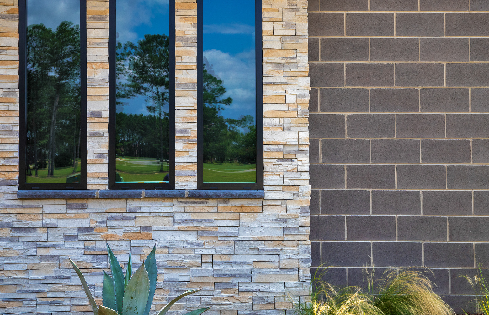 Stunning architecture featuring a unique combination of stone veneer ...