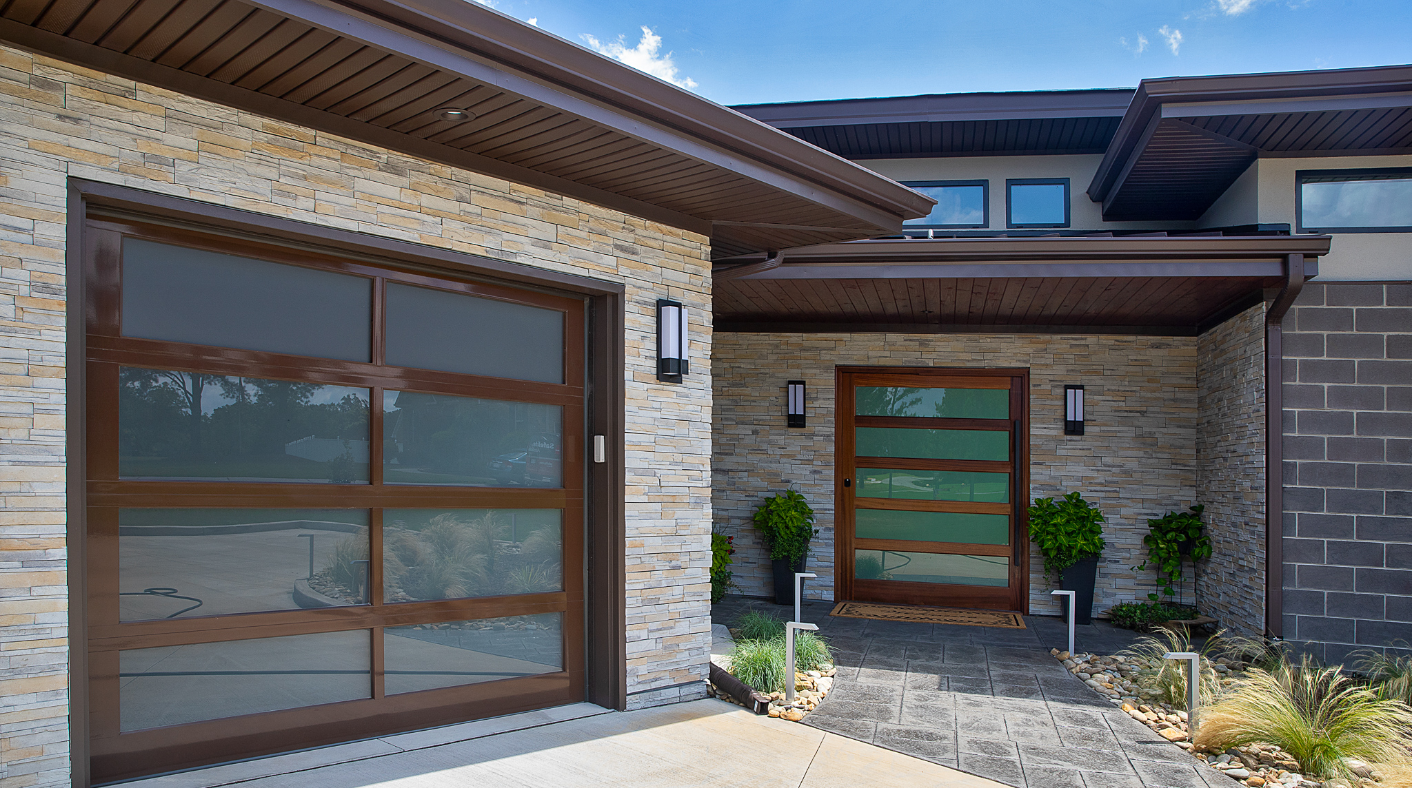 Stunning architecture featuring a unique combination of stone veneer ...