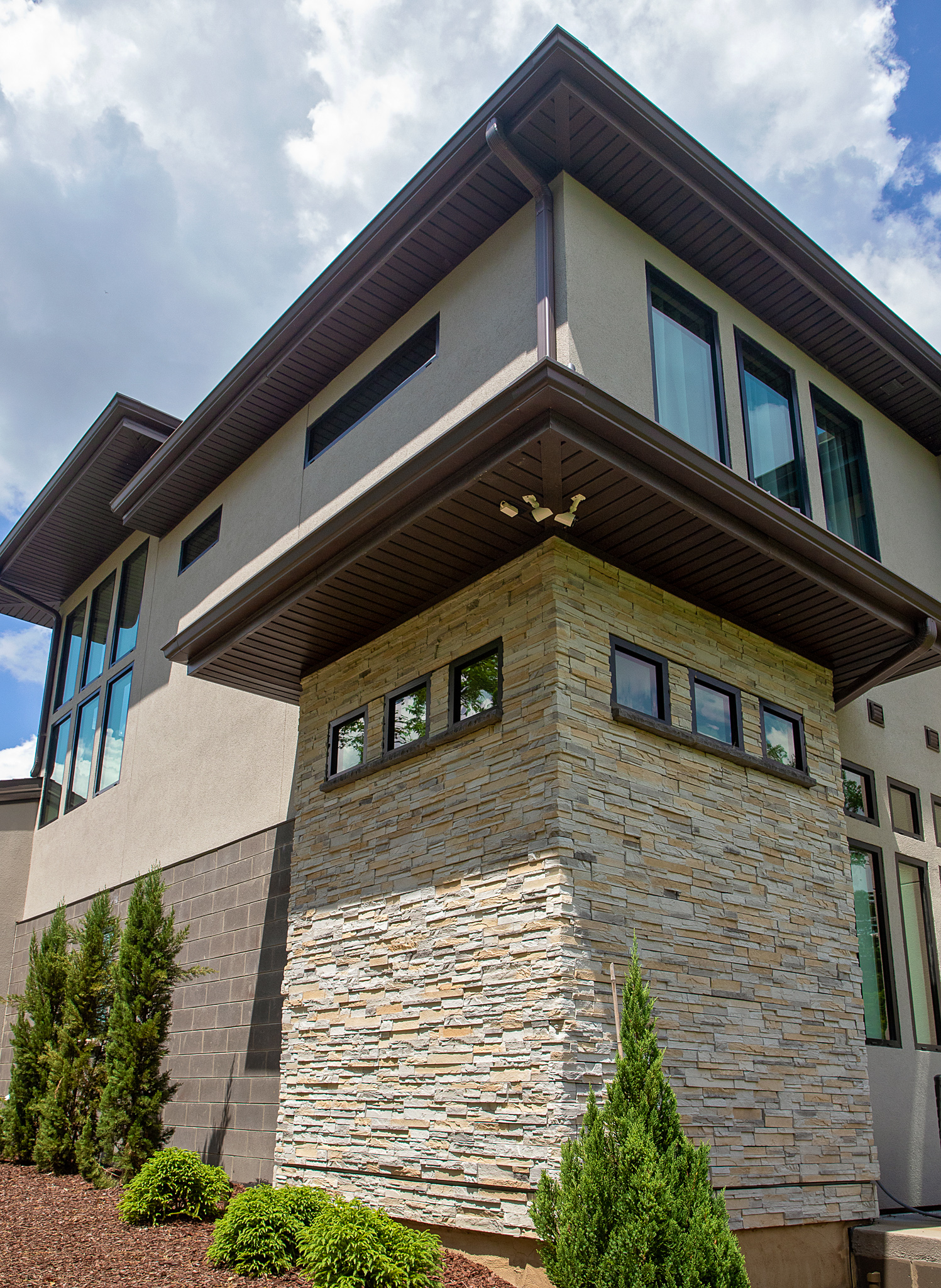 Stunning architecture featuring a unique combination of stone veneer ...